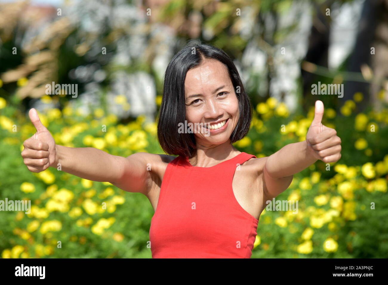 Minority Female With Thumbs Up Stock Photo - Alamy