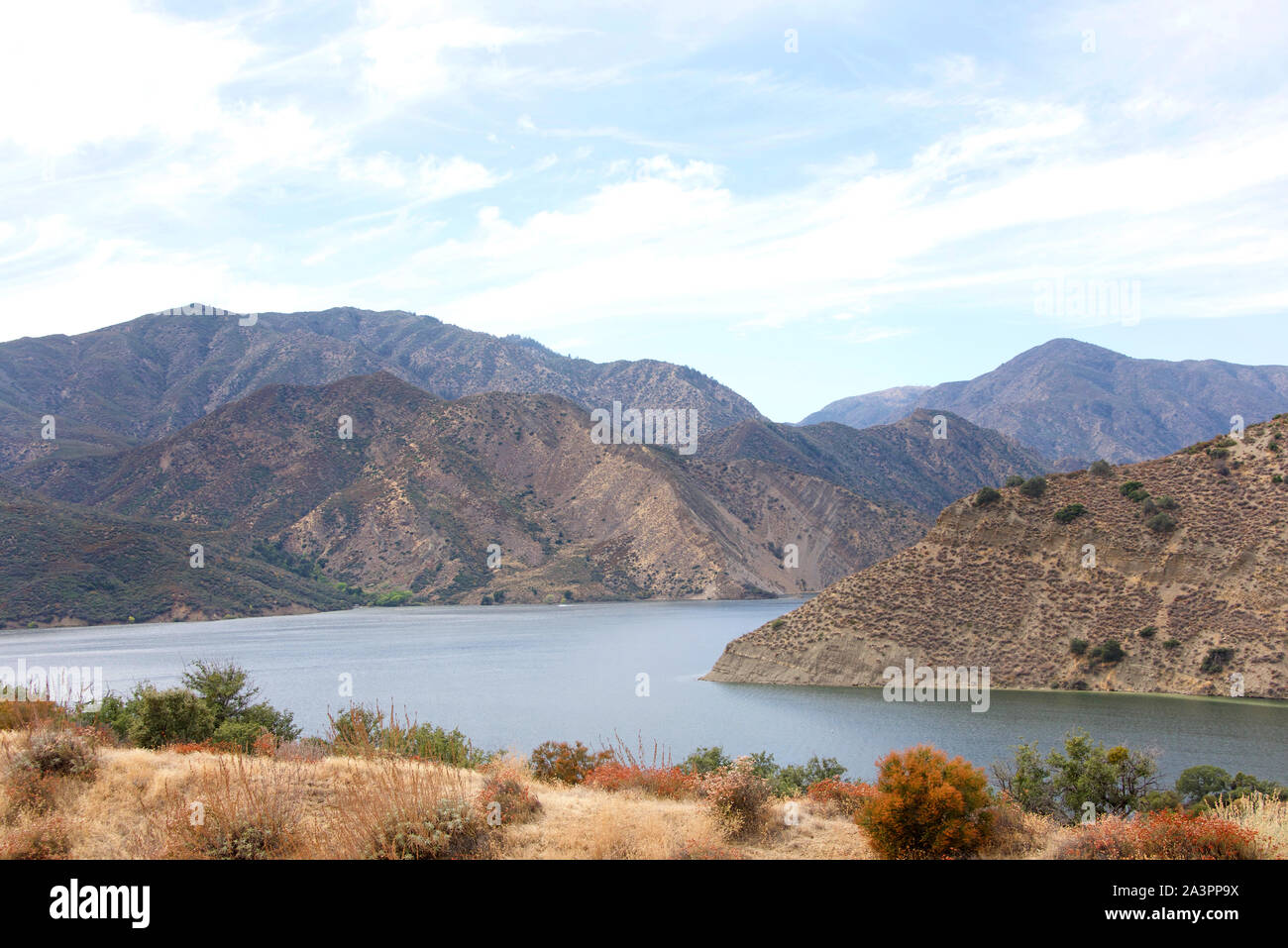 View of half of Pyramid Lake with cloudy blue sky background. Pyramid ...