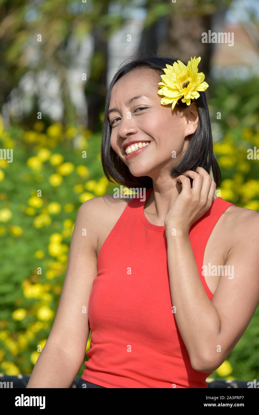 Woman with a flower hi-res stock photography and images - Alamy