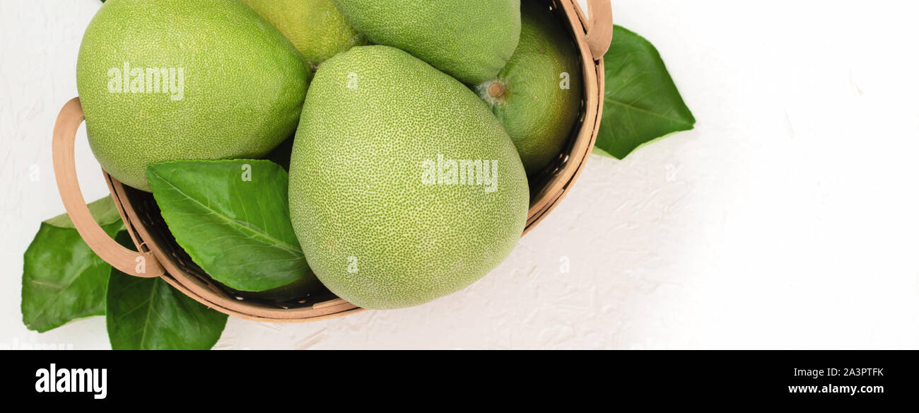 Fresh pomelo, pummelo, grapefruit, shaddock on white cement background ...
