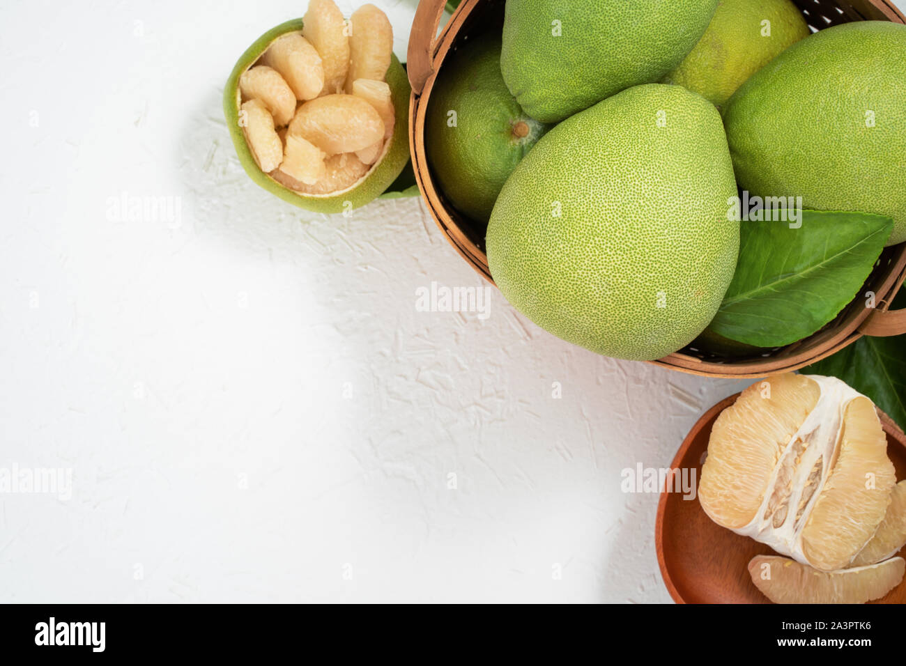 Fresh pomelo, pummelo, grapefruit, shaddock on white cement background ...