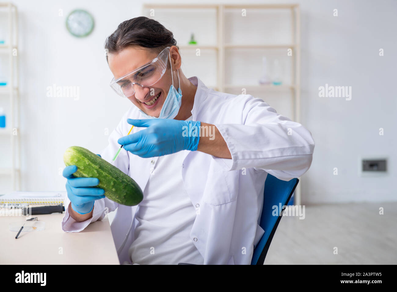 The male nutrition expert testing vegetables in lab Stock Photo - Alamy