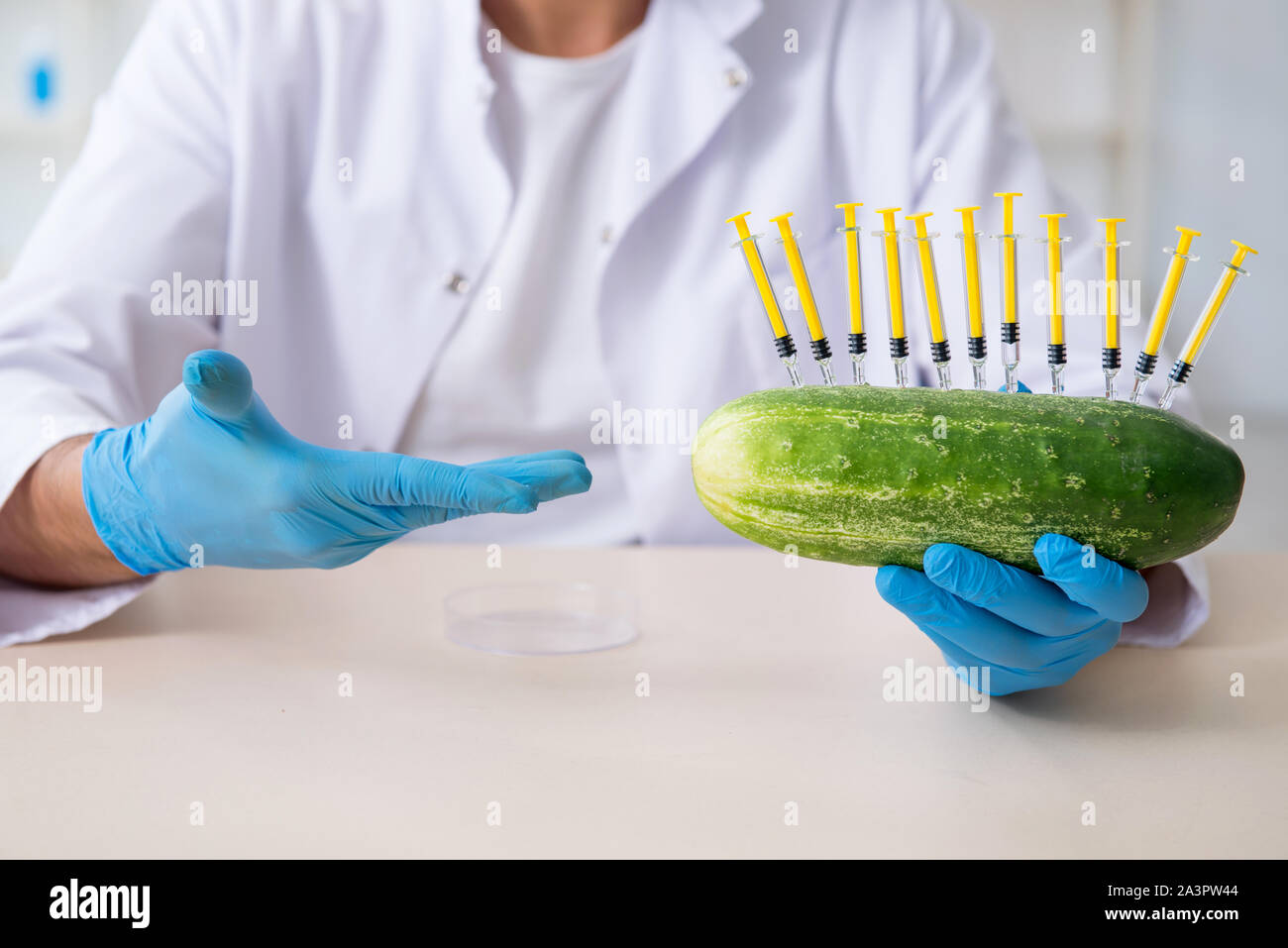 The male nutrition expert testing vegetables in lab Stock Photo - Alamy