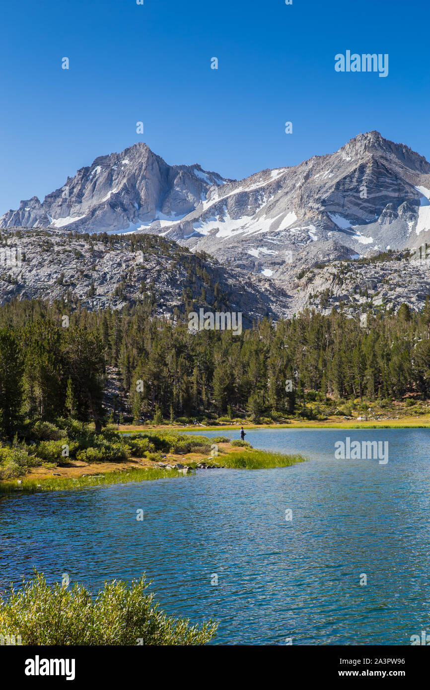 Fisherman fishing at Long Lake in Little Lakes Valley Eastern Sierra ...