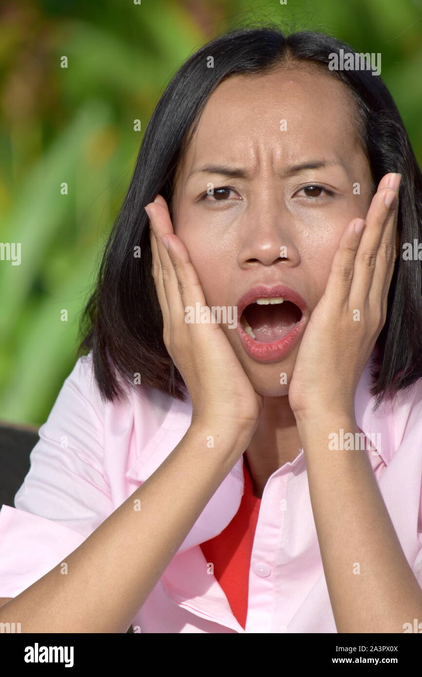 Shocked Youthful Filipina Woman Stock Photo - Alamy