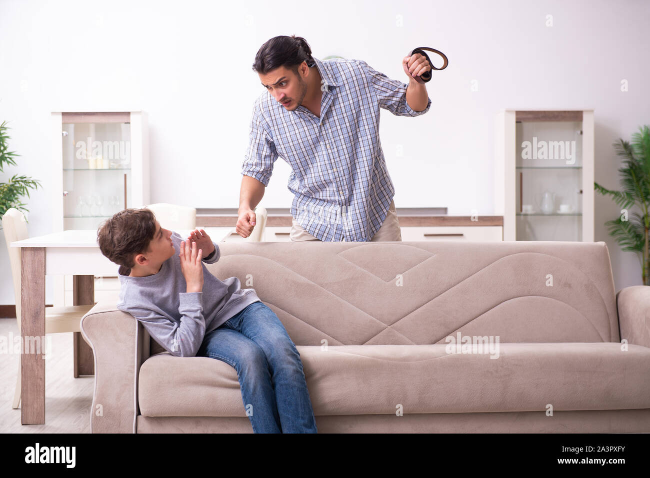 The father beating and punishing his sone Stock Photo - Alamy