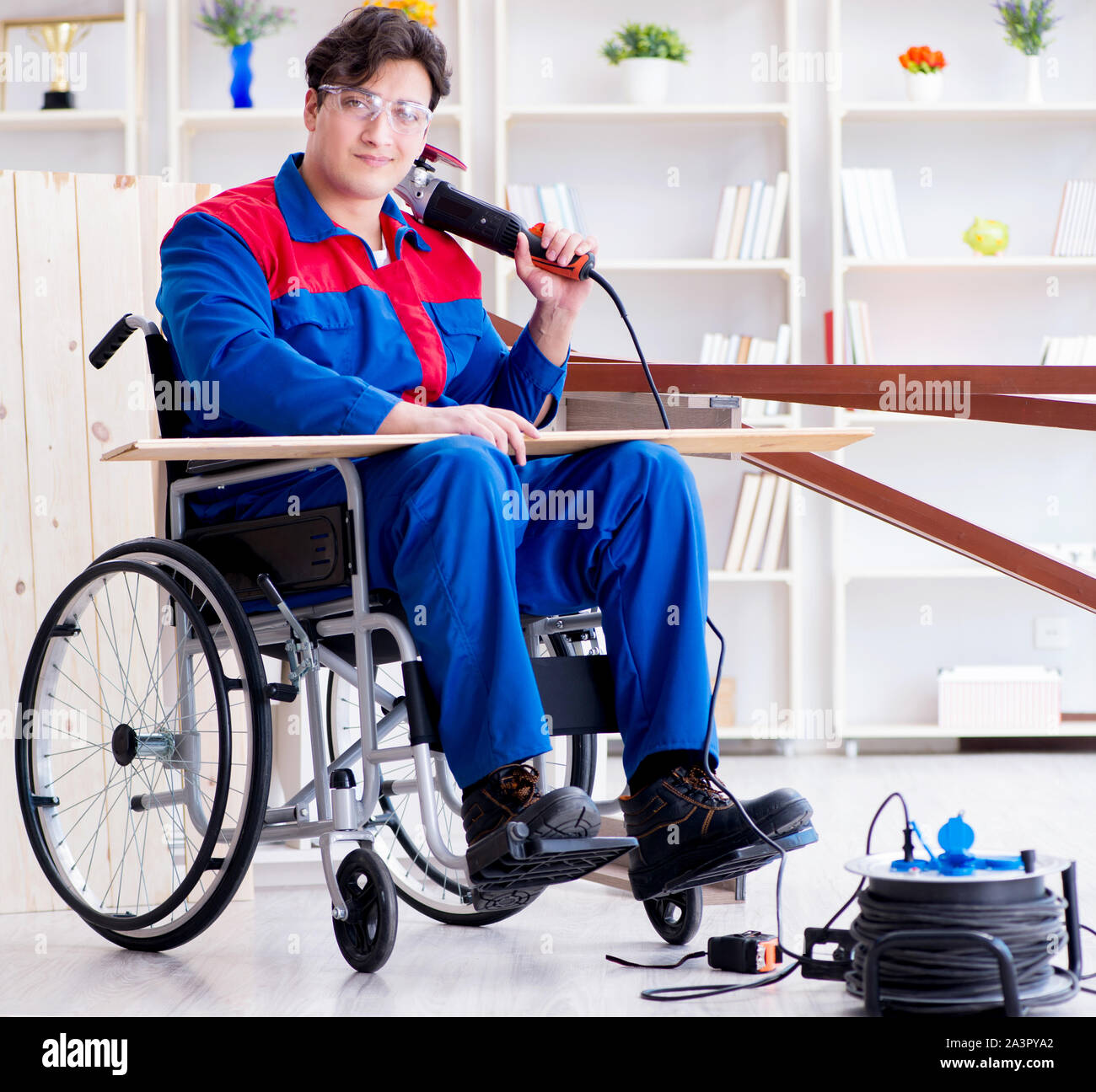 The disabled carpenter working with tools in workshop Stock Photo - Alamy