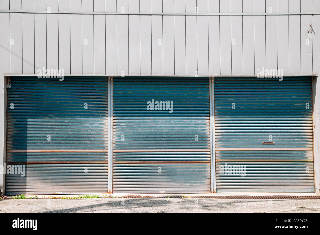 Closed metal shutter door of building Stock Photo - Alamy
