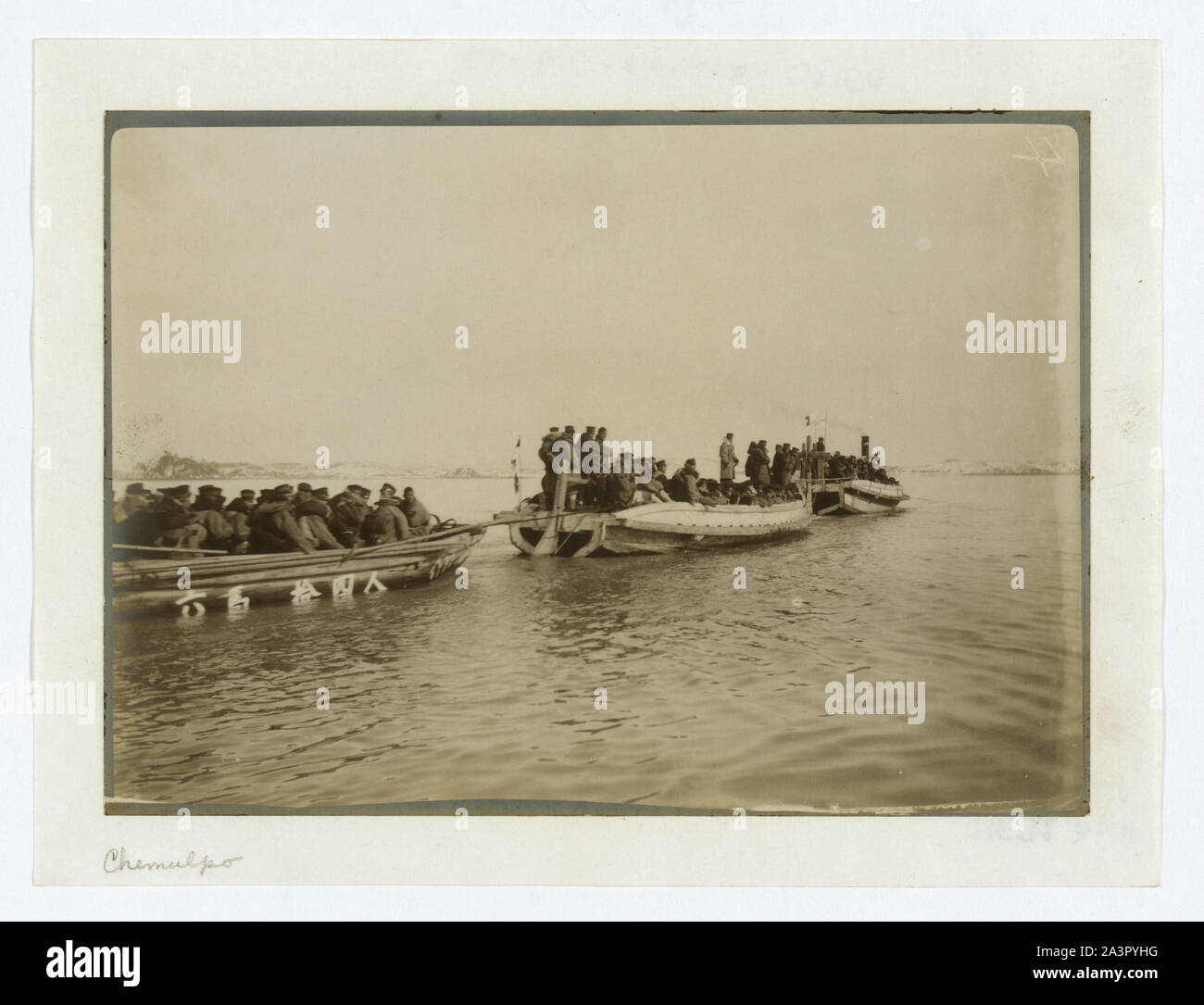 Steam launch carrying six over-crowded boat loads soldiers to landing ...