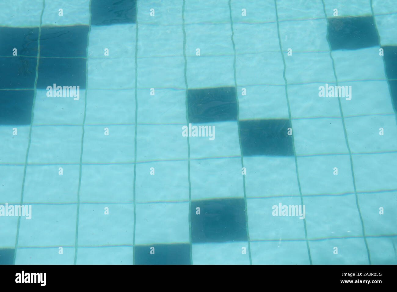 Blue pool water reflecting sun rippled details.surface of blue pool ...