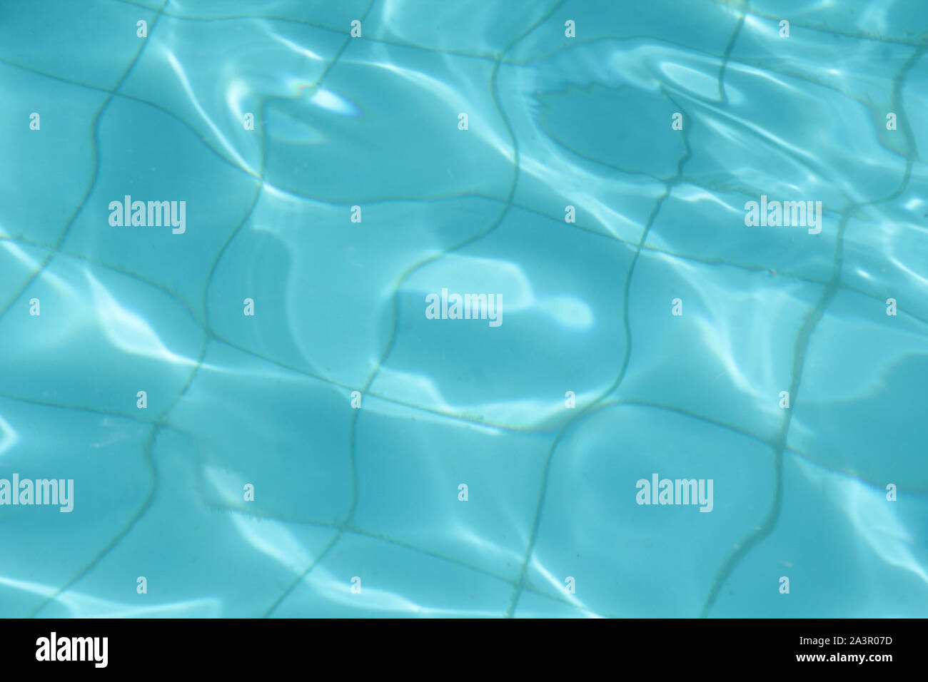 Blue pool water reflecting sun rippled details.surface of blue pool ...