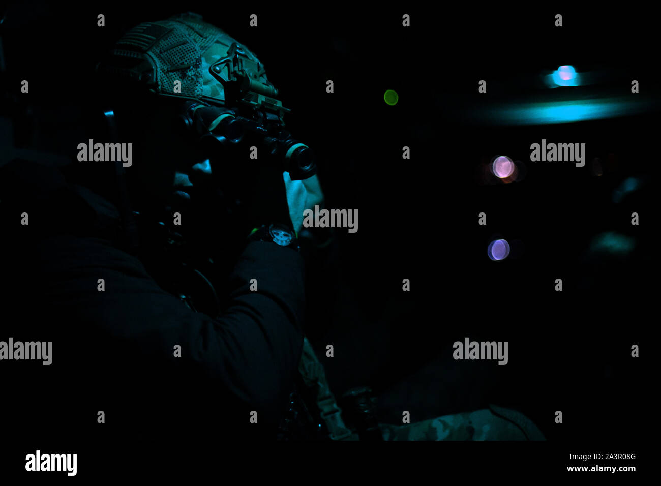 An Airman assigned to the 352nd Special Operations Wing adjusts his ...