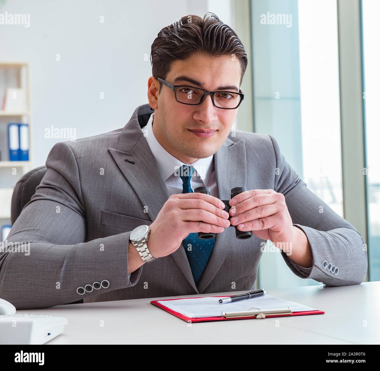 The man looking for errors and mistakes in report Stock Photo - Alamy