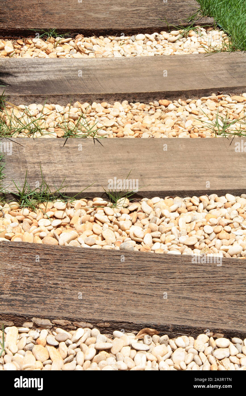 path with natural rustic wood and stones, ideal for texture background ...