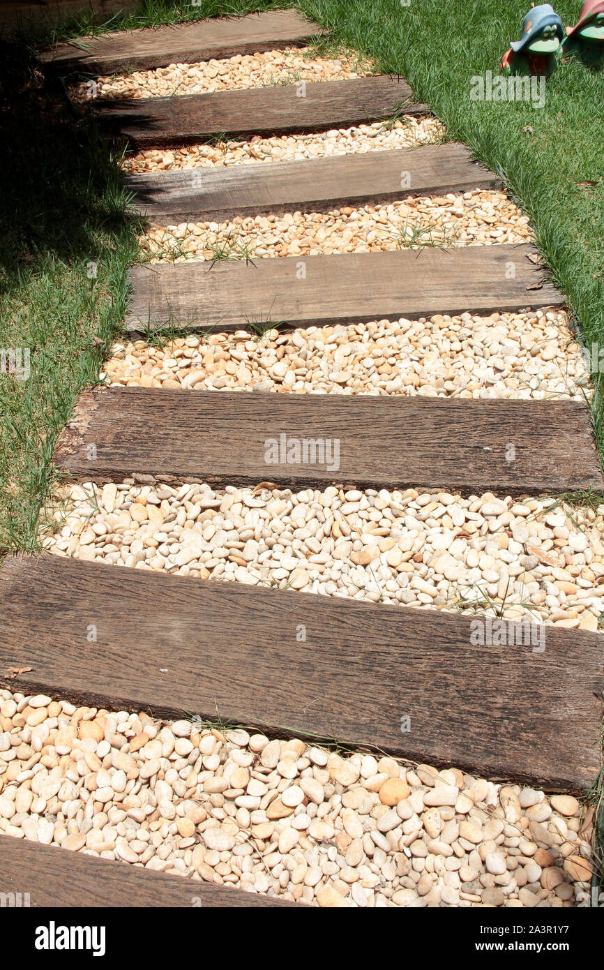 path with natural rustic wood and stones, ideal for texture background ...
