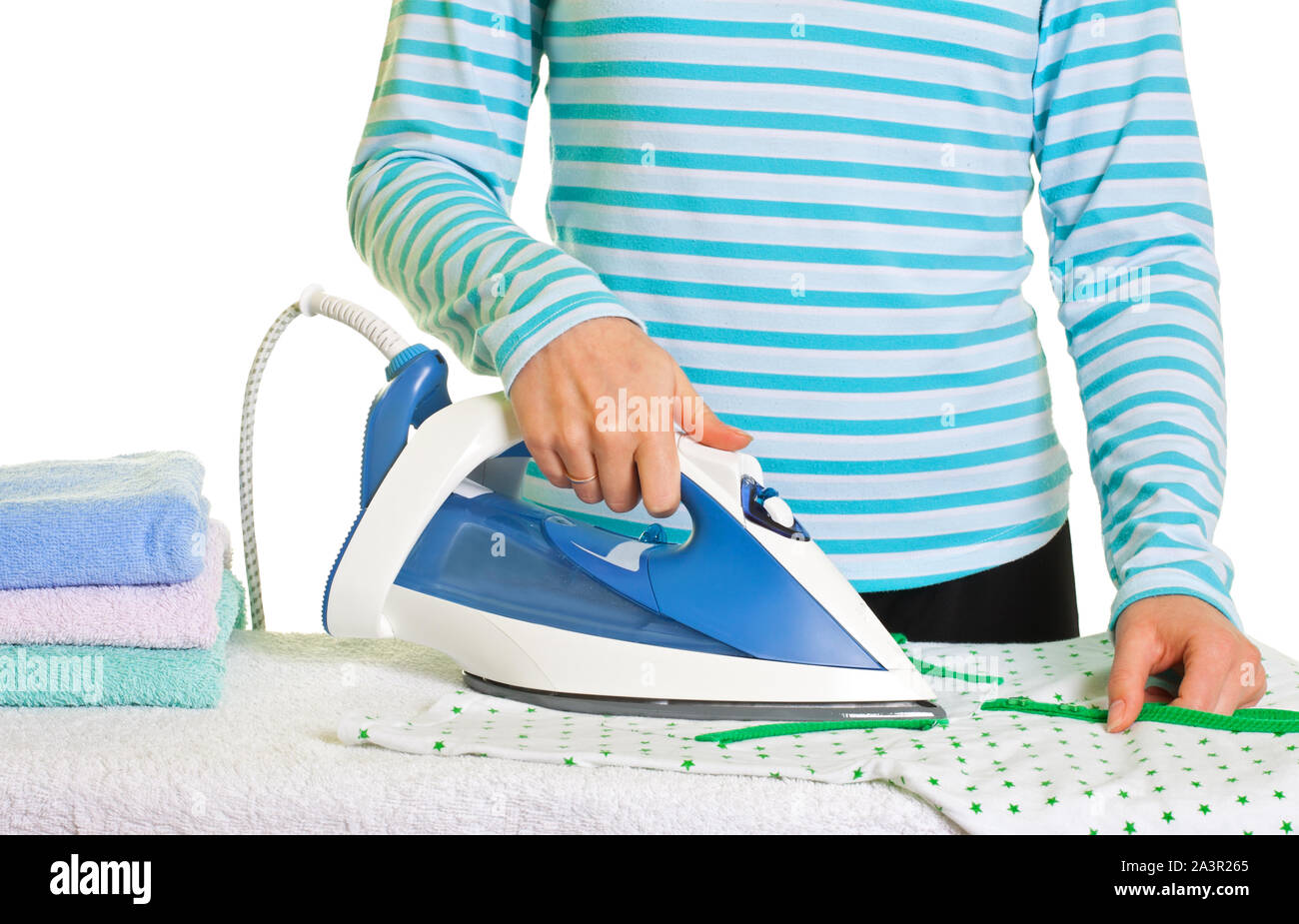 Sweet young lady ironing her clothes Stock Photo - Alamy