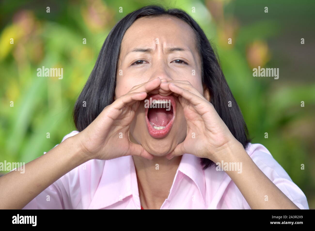 An Attractive Asian Female Shouting Stock Photo - Alamy