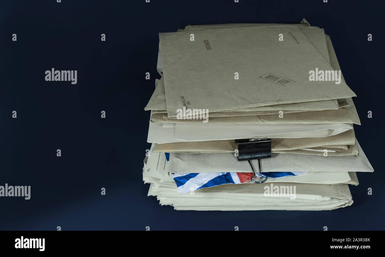Stacked files and documents, copy-space, low-key. UK Stock Photo - Alamy
