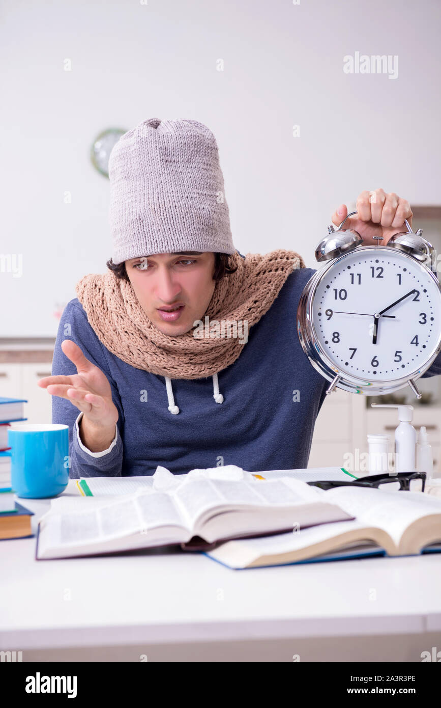 The sick male student suffering at home Stock Photo - Alamy