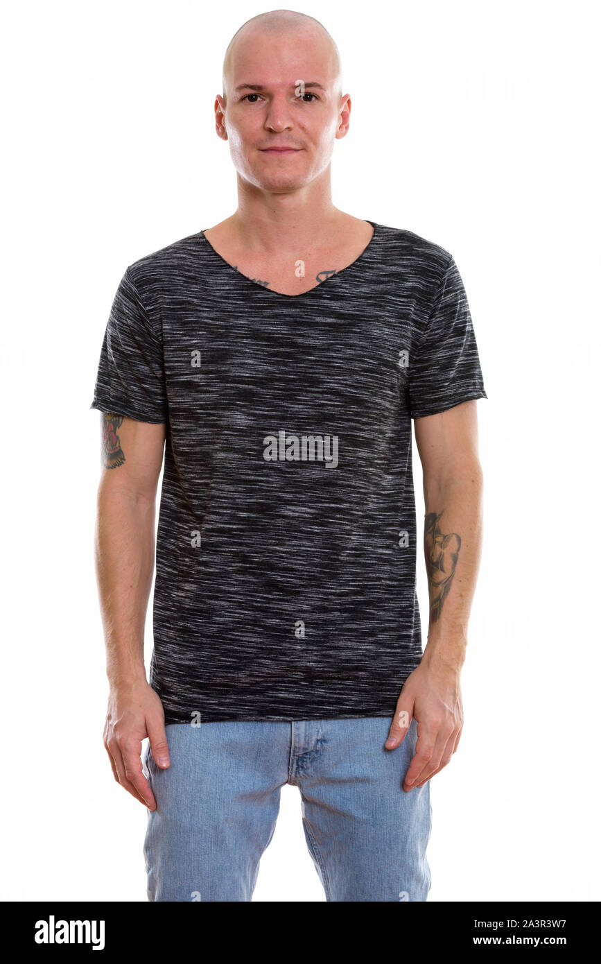 Studio shot of young handsome bald man standing Stock Photo - Alamy