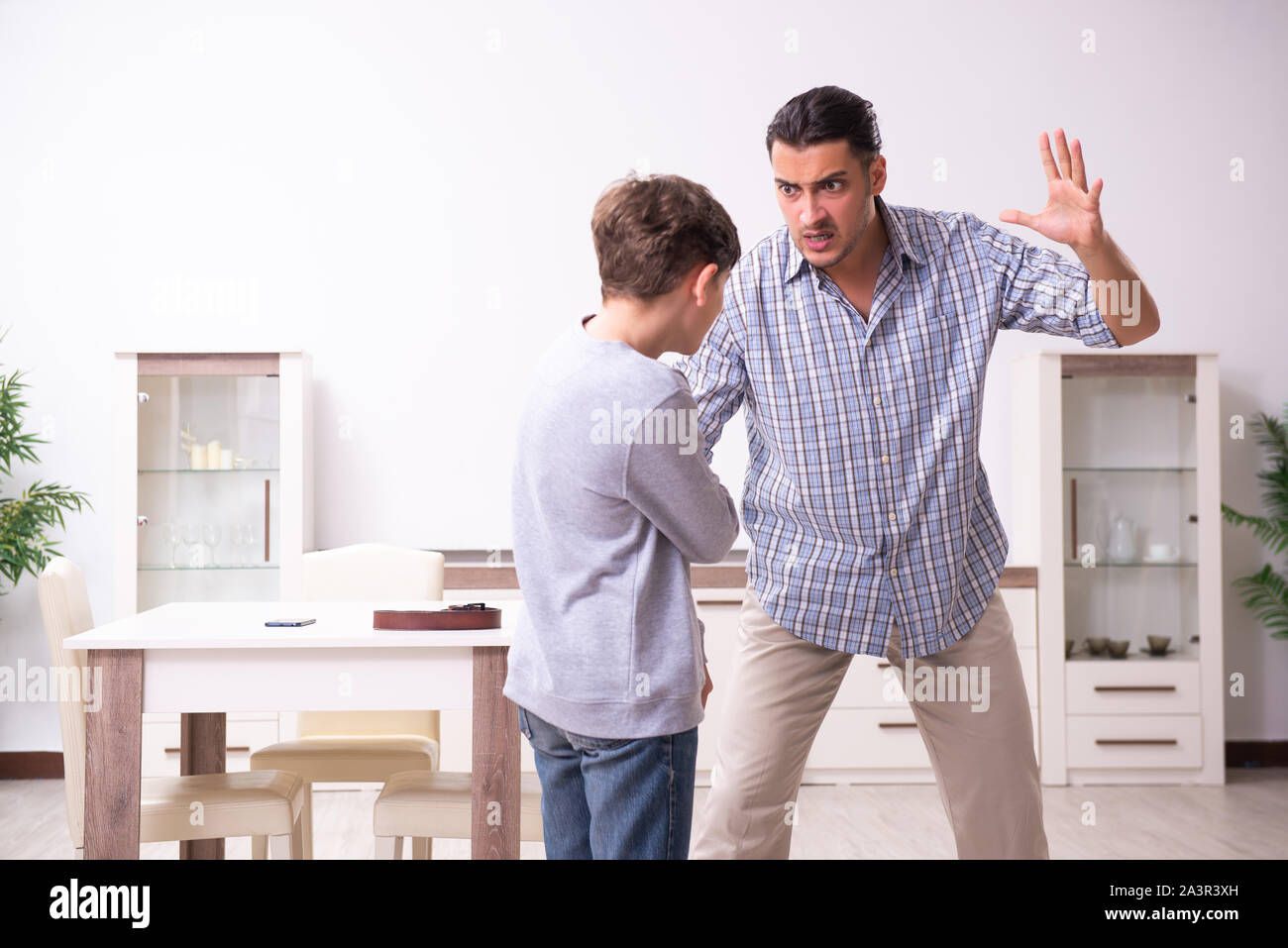The father beating and punishing his sone Stock Photo - Alamy