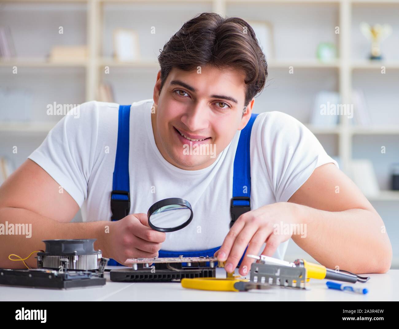 The computer repairman repairing desktop computer Stock Photo - Alamy