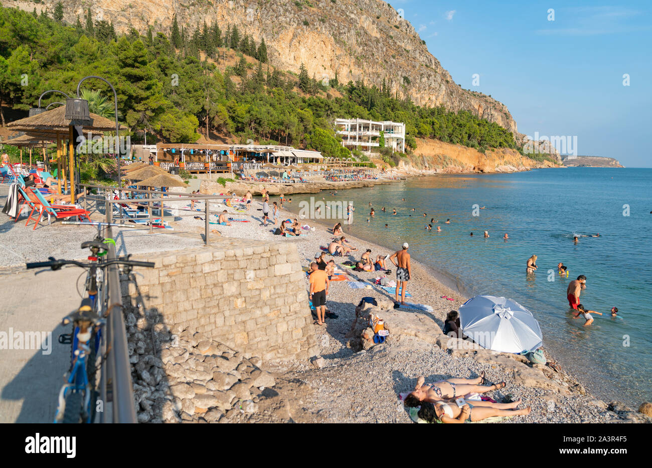 Nafplio Greece - July 19 2019; Beachgoers at Arvanitia Beach in Greece ...