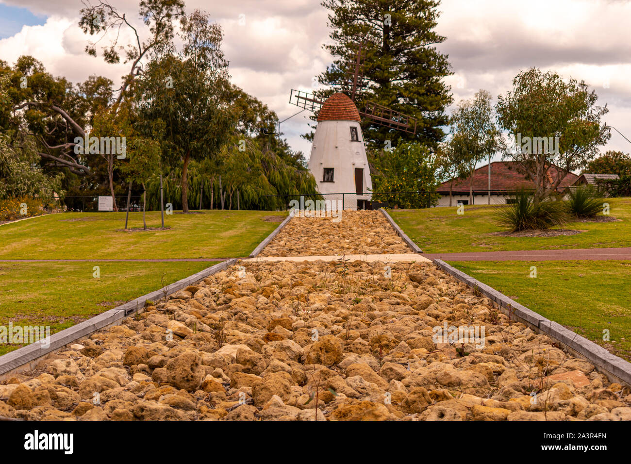 Rocky path to a windmill Stock Photo - Alamy