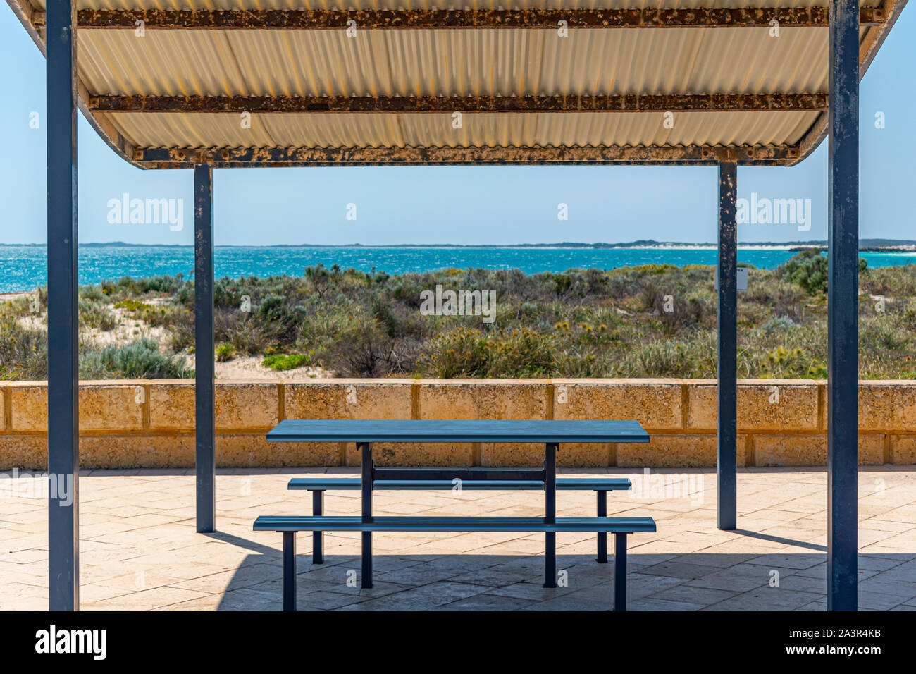 Beach view from a shaded bench Stock Photo - Alamy