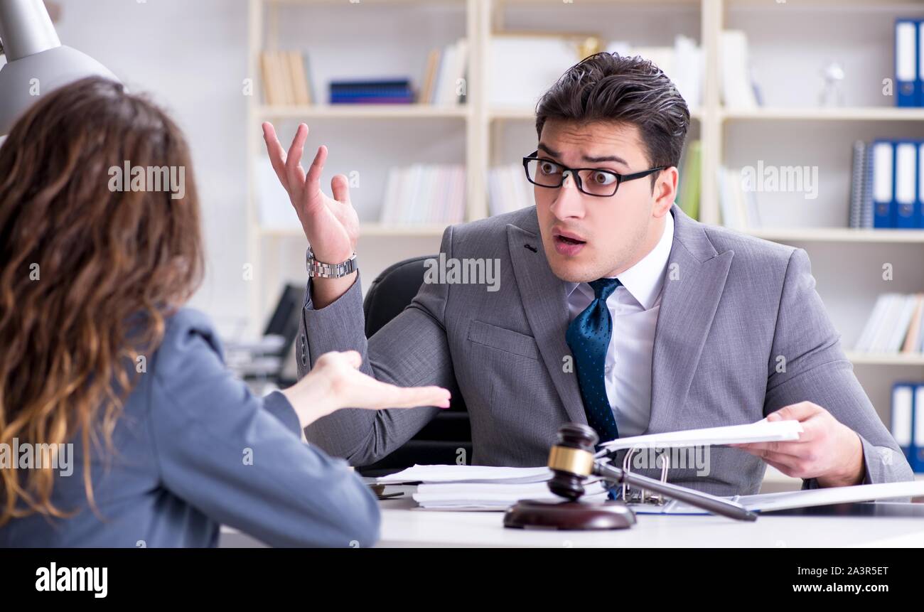 The lawyer discussing legal case with client Stock Photo - Alamy