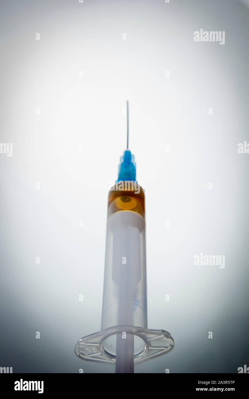Medical hypodermic needle on a white background Stock Photo - Alamy