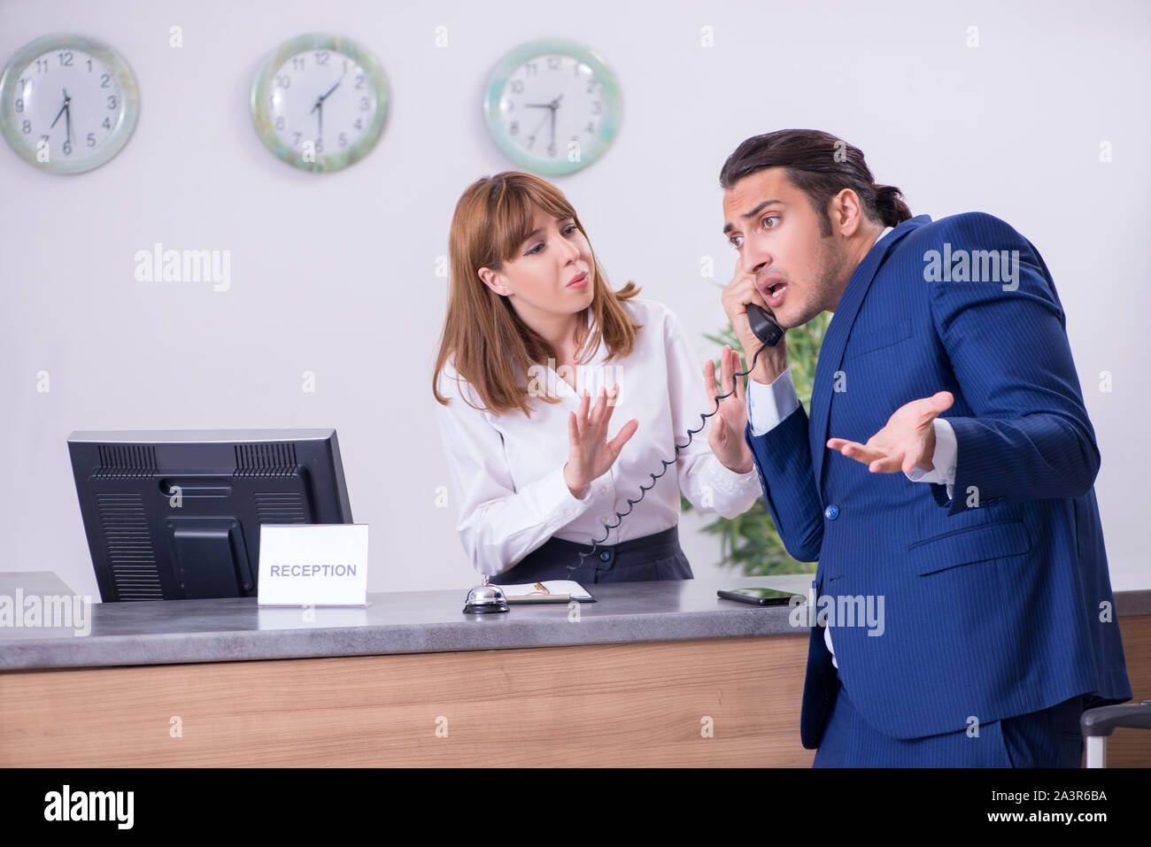 Woman hotel reception angry hi-res stock photography and images - Alamy