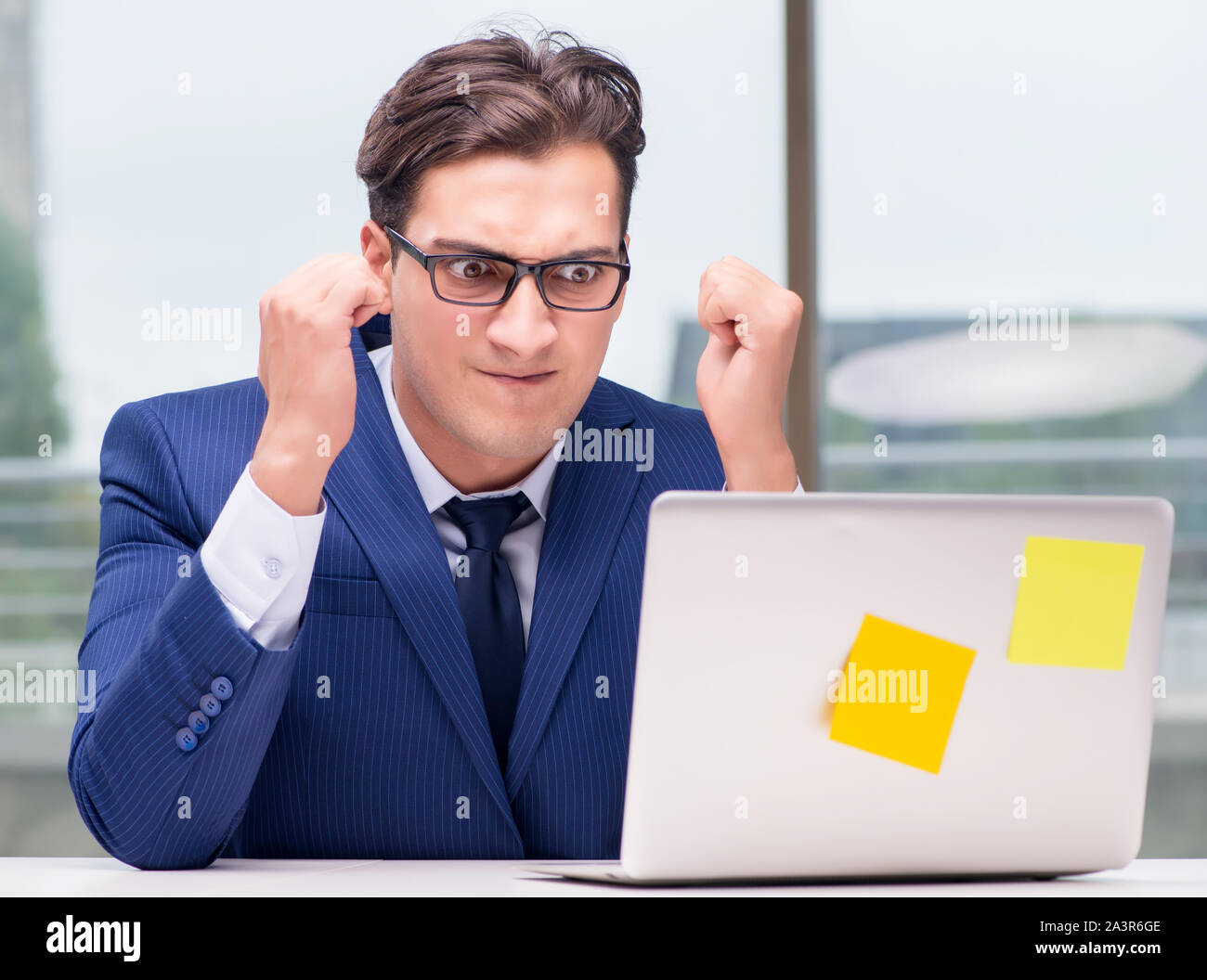 The workaholic businessman overworked with too much work in office ...