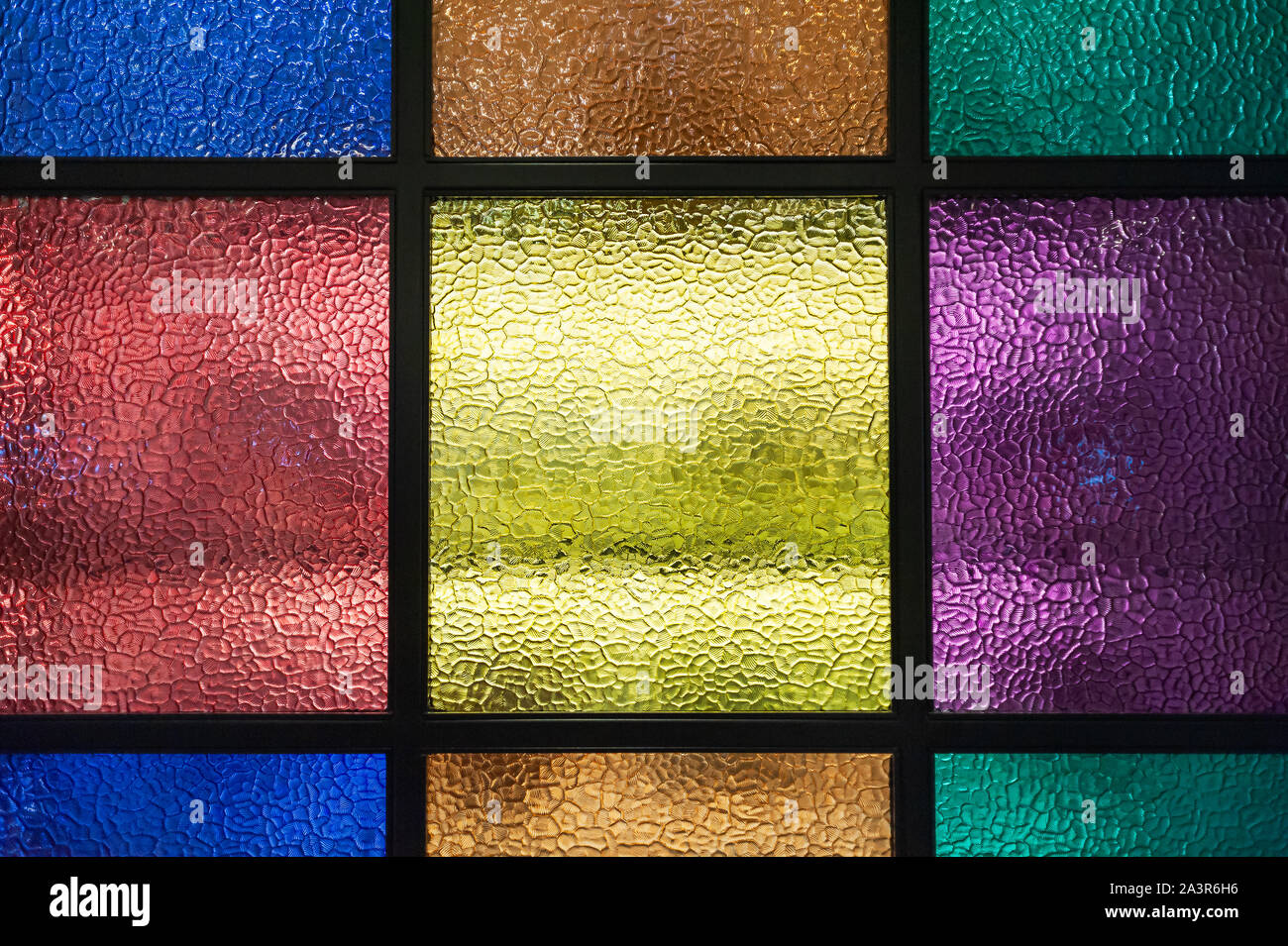 Decorative window of various colored rectangles with light coming ...