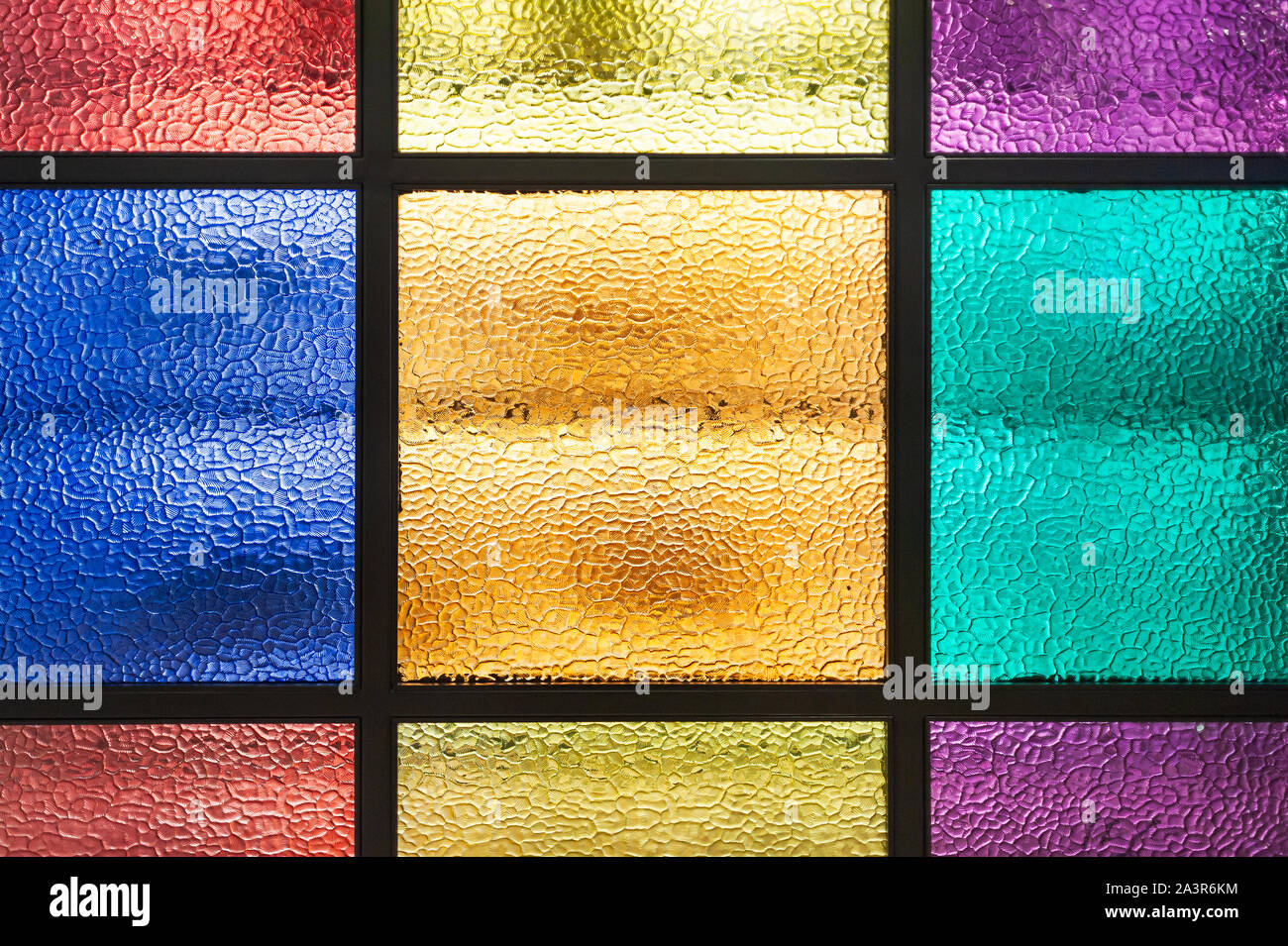 Decorative window of various colored rectangles with light coming ...