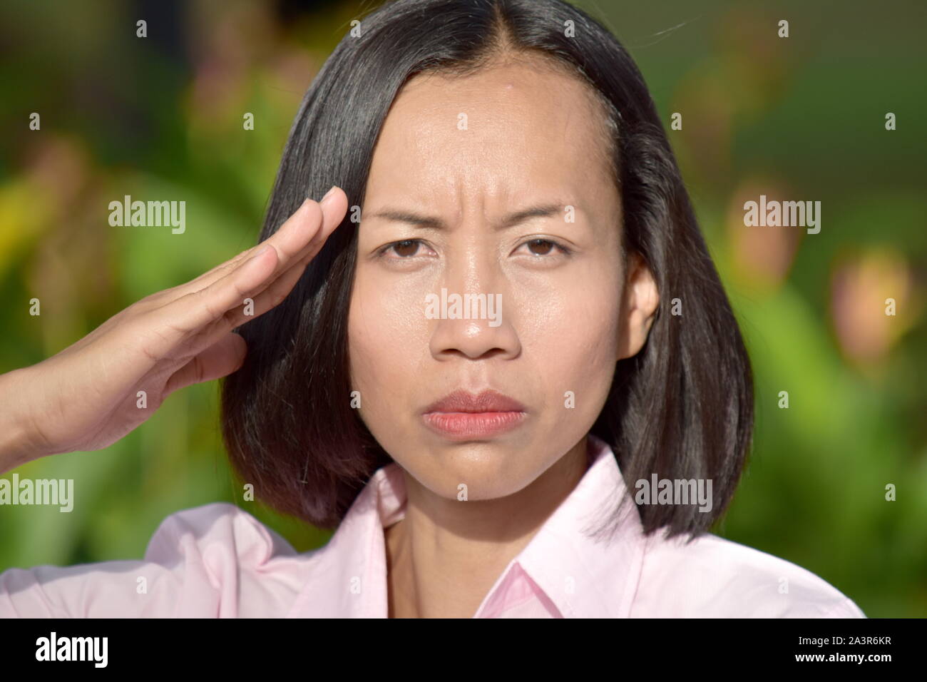 An Attractive Diverse Female Saluting Stock Photo - Alamy