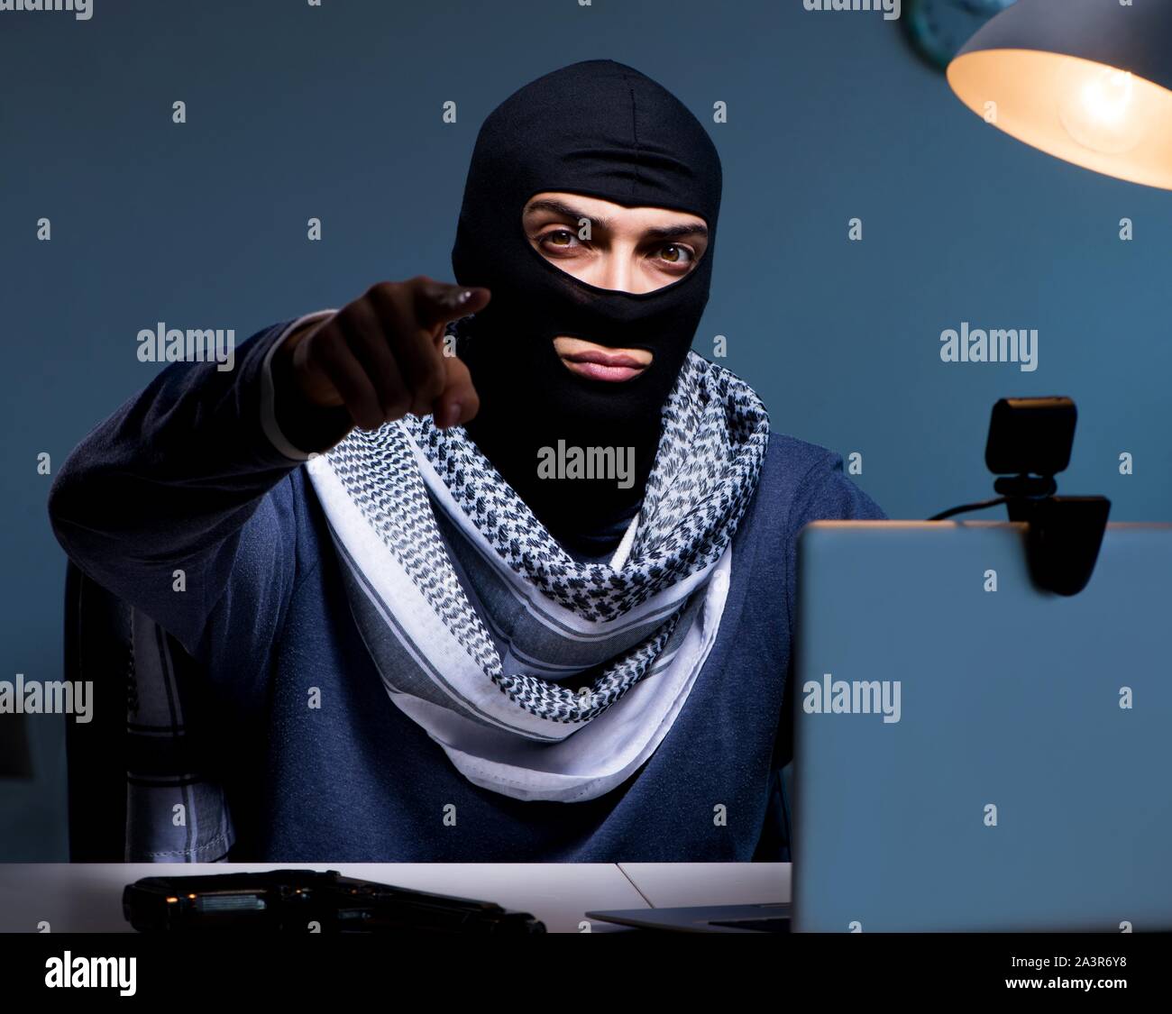 The hacker wearing balaclava mask hacking computer Stock Photo - Alamy