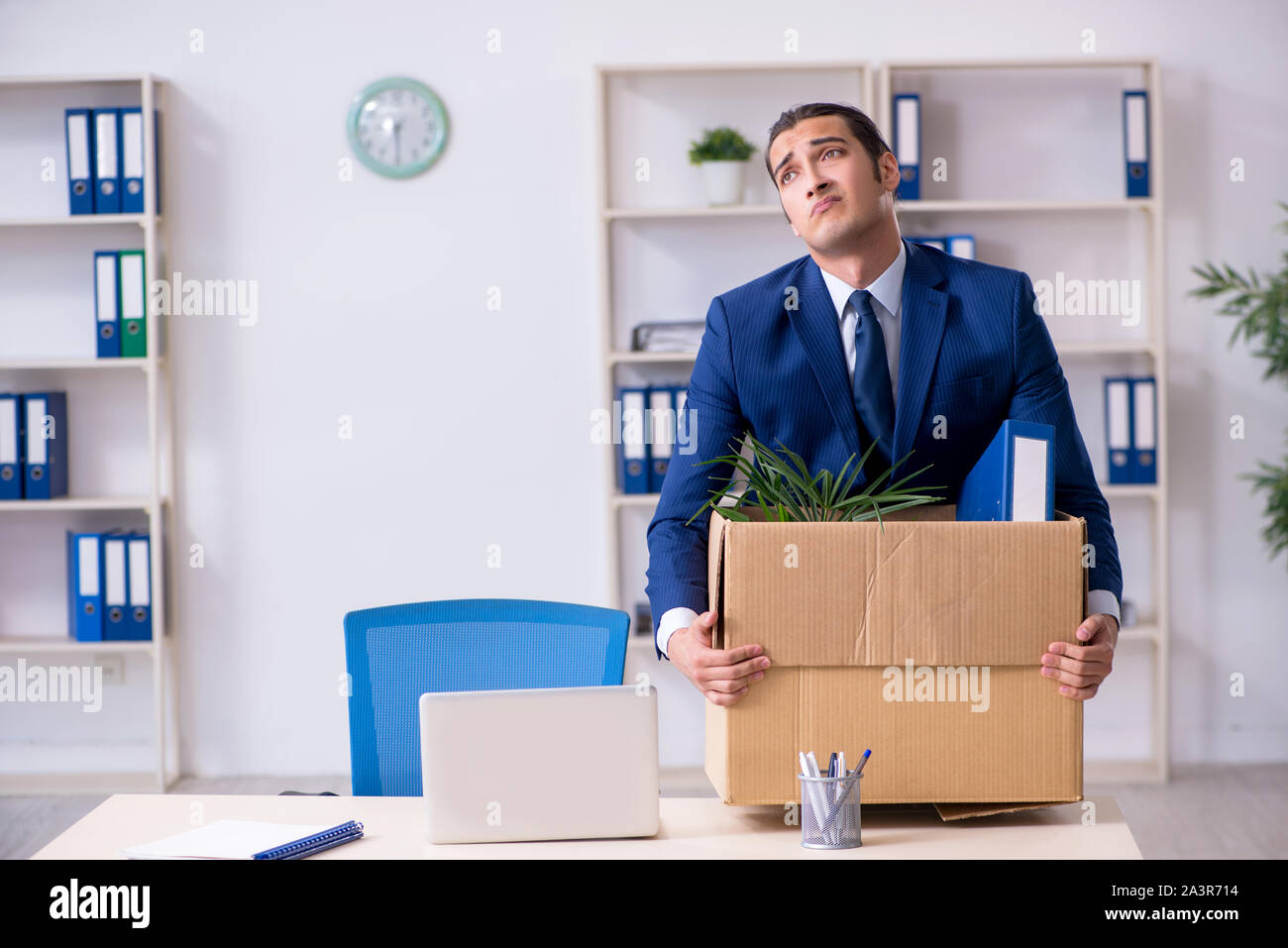 The young employee being made redundant Stock Photo - Alamy