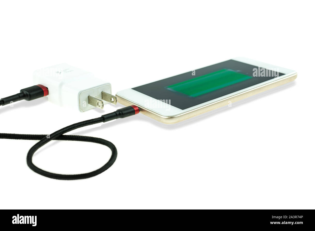 Adapter smart phone charger at plug in power outlet at white background ...