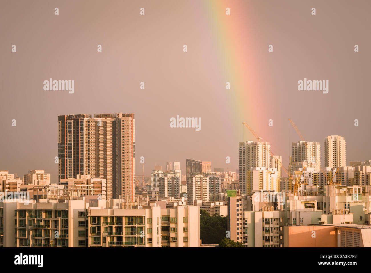 Beautiful rainbow over city apartments after heavy storm Stock Photo ...