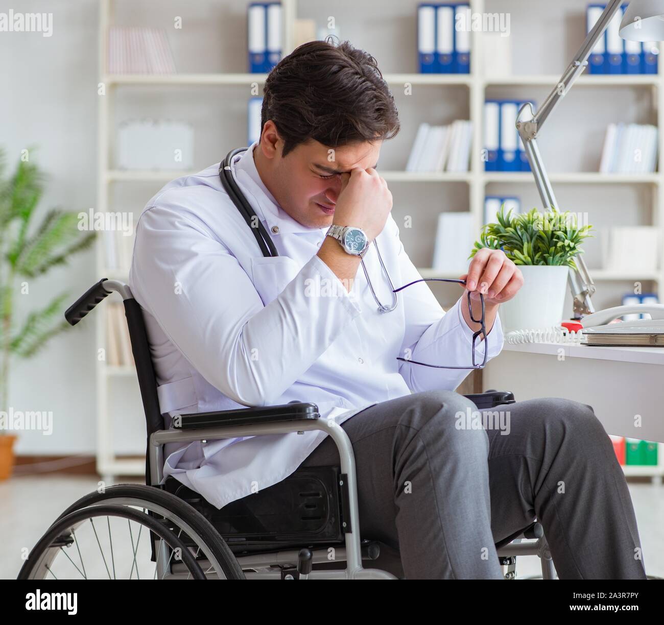 The disabled doctor on wheelchair working in hospital Stock Photo - Alamy