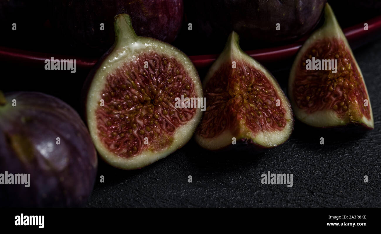 fresh figs close-up photo on black background. dark moody photo Stock ...