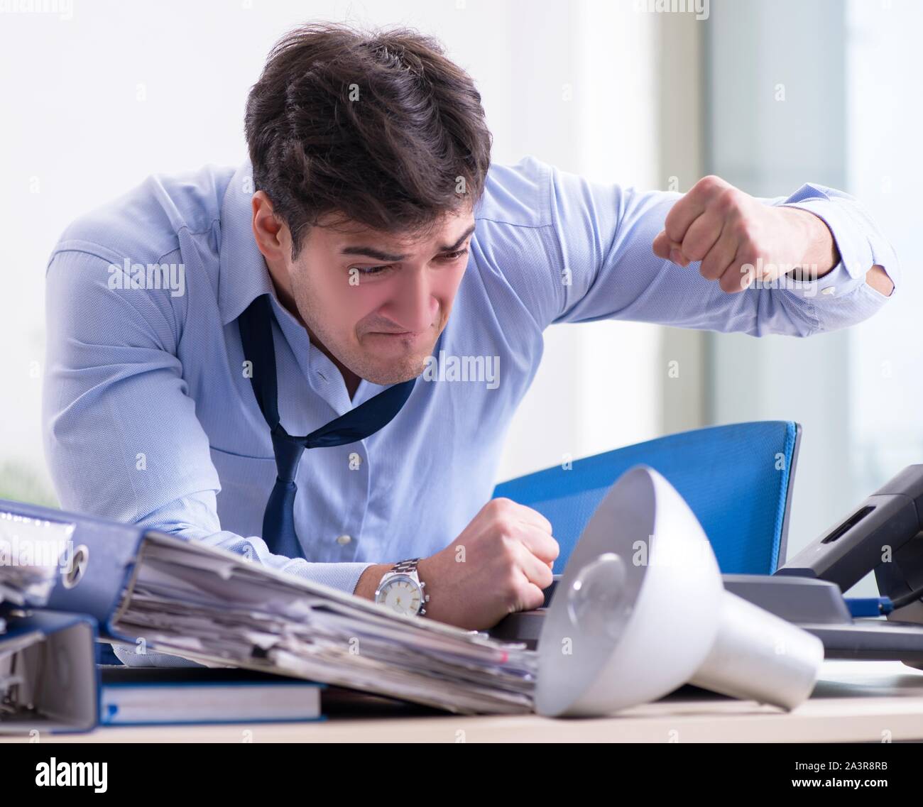 The angry businessman frustrated with too much work Stock Photo - Alamy