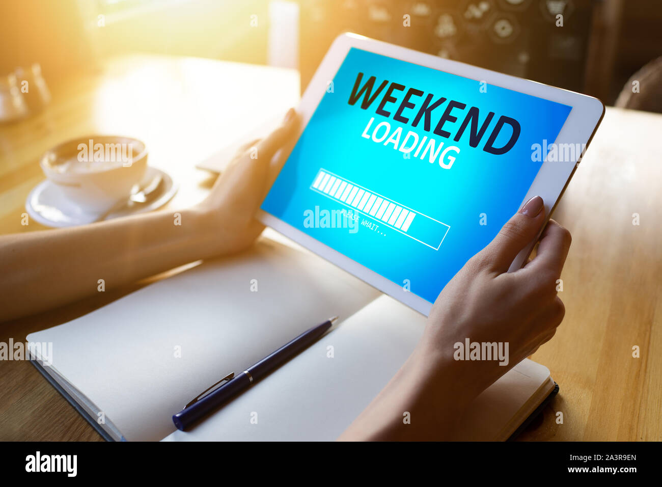 Weekend loading status bar message on device screen Stock Photo - Alamy