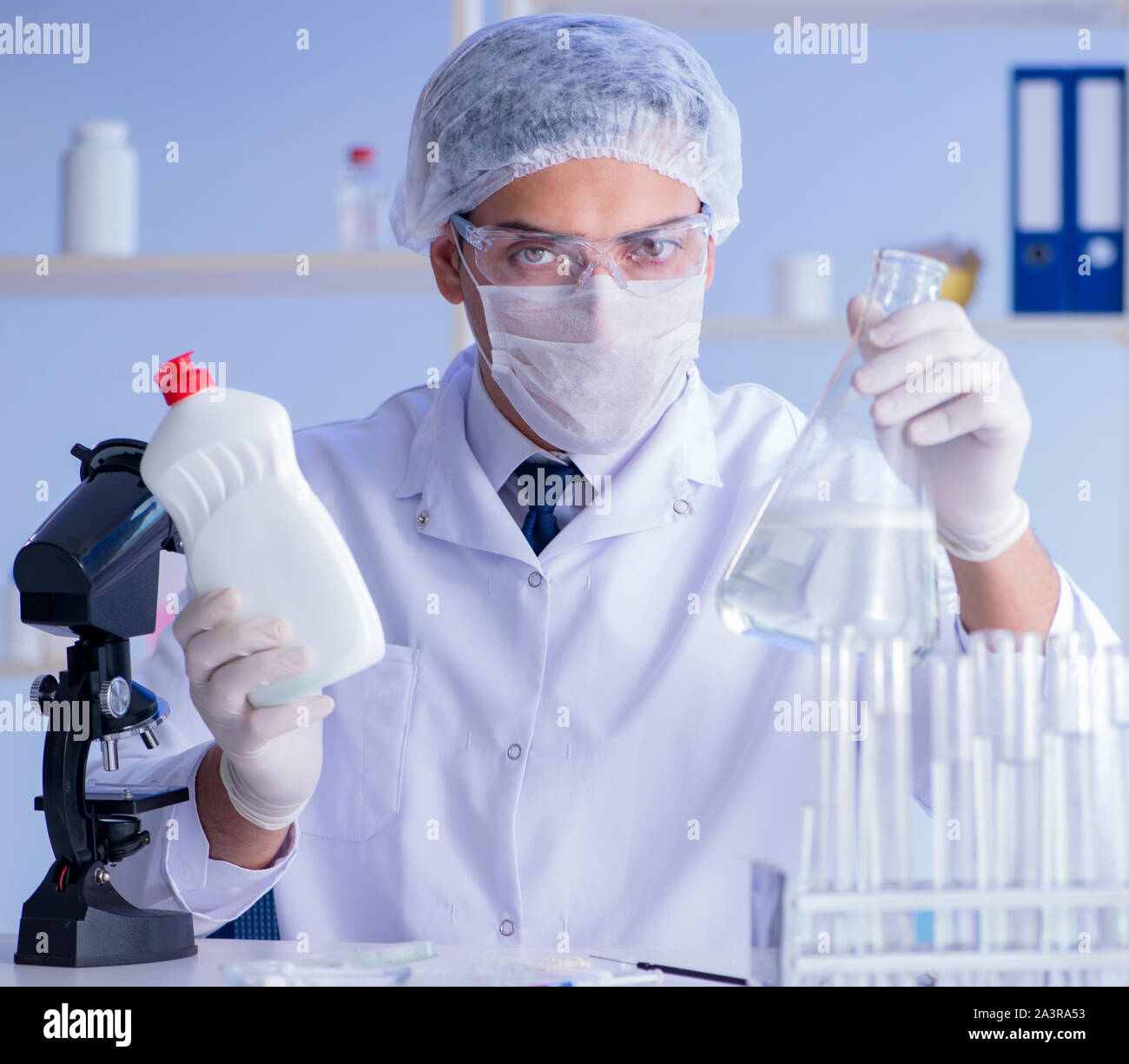 The man in the lab testing new cleaning solution detergent Stock Photo ...