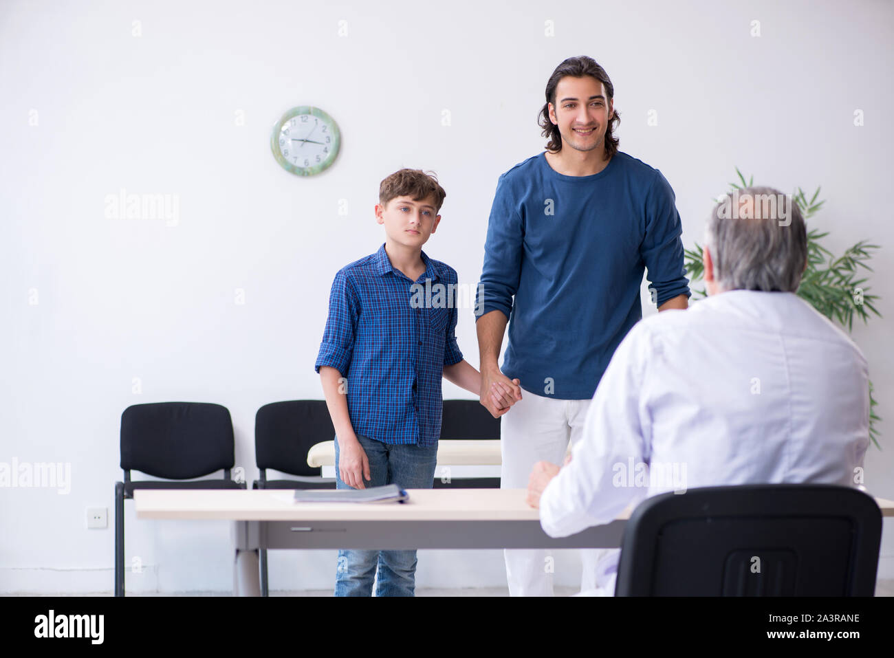 The young boy visiting doctor in hospital Stock Photo - Alamy