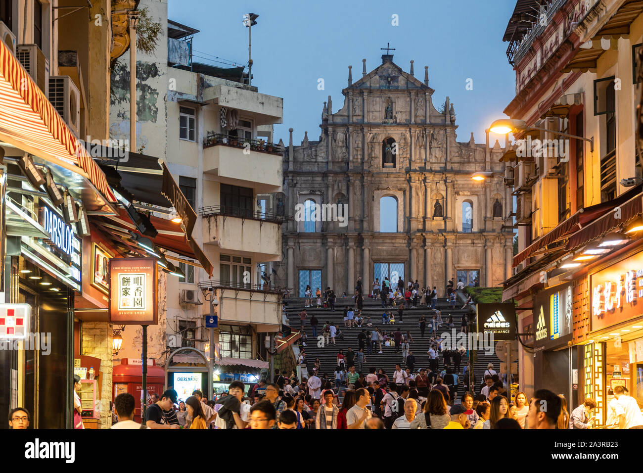Macau, China - October 15 2018: Tourists stolling around the narrow ...