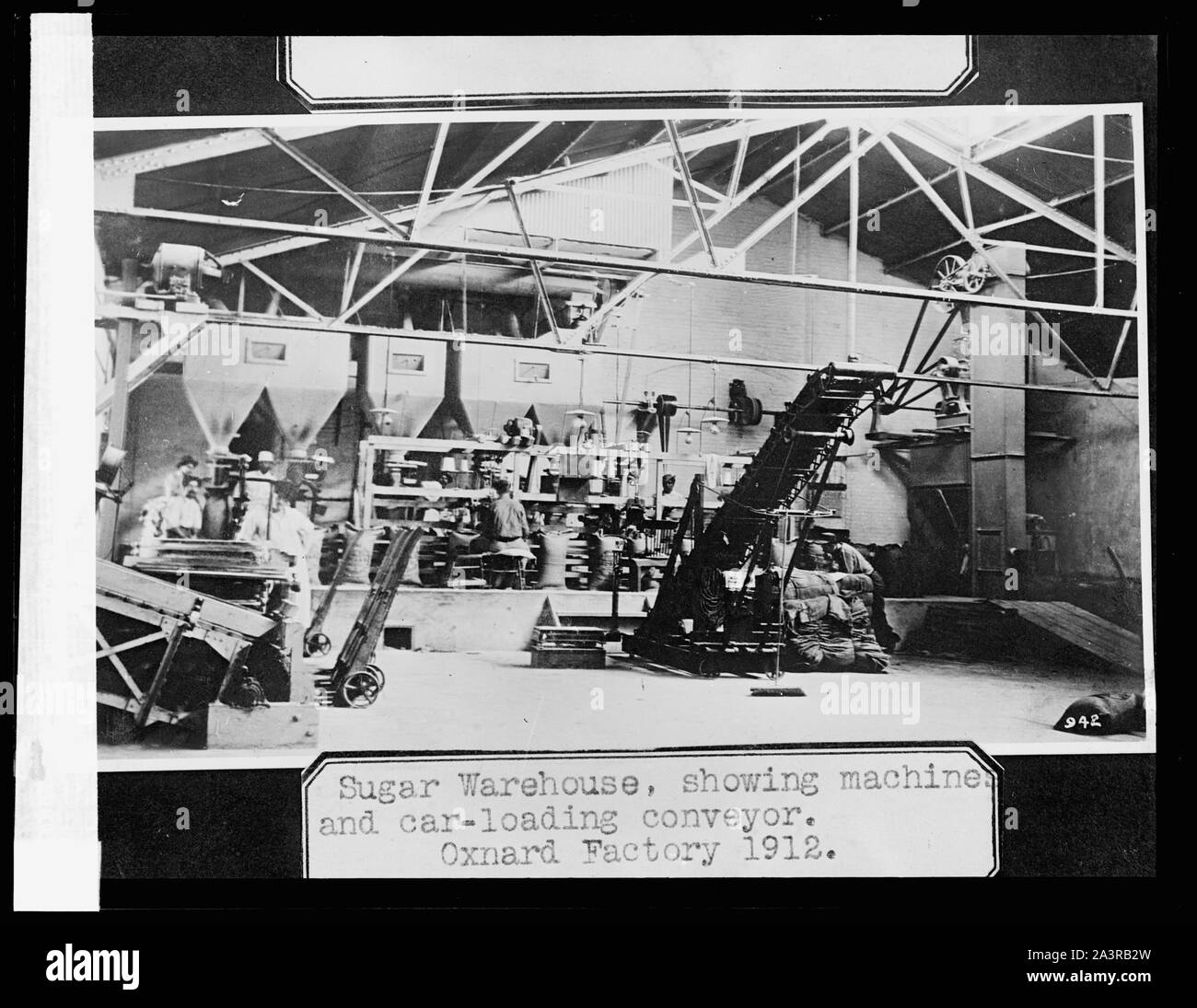 Sugar warehouse, showing machines and car-loading conveyer Stock Photo ...