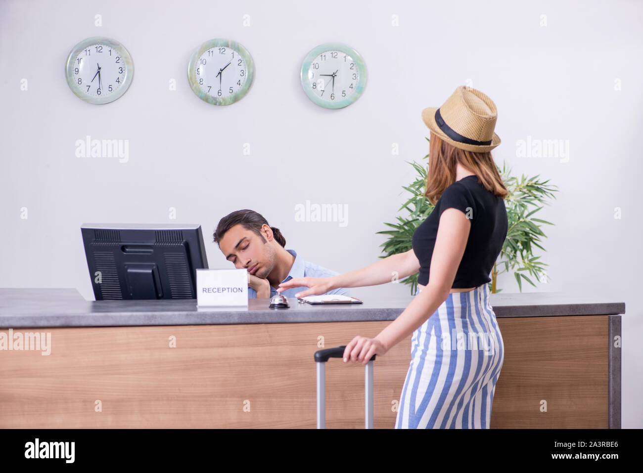 The young woman at hotel reception Stock Photo - Alamy