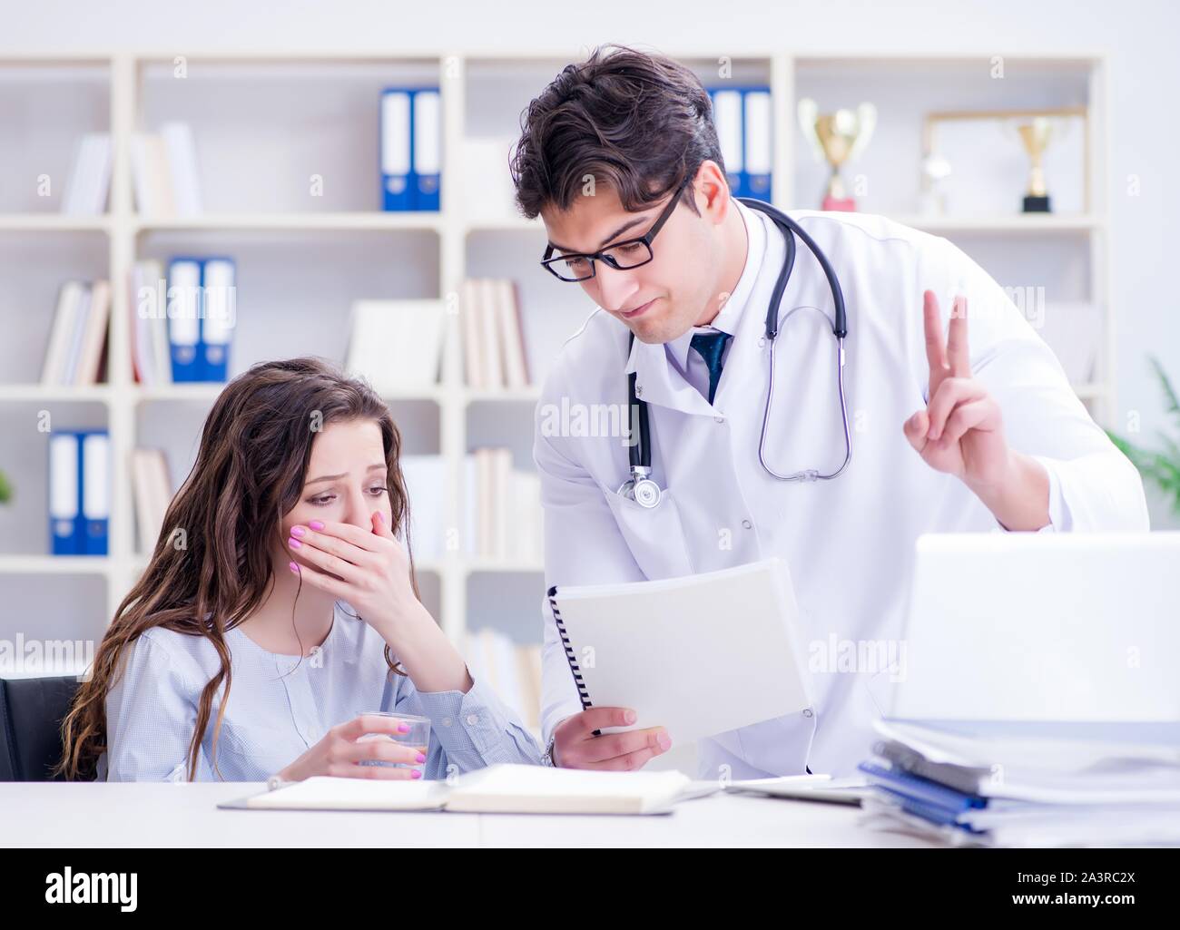 The doctor sharing discouraging lab test results to patient Stock Photo ...